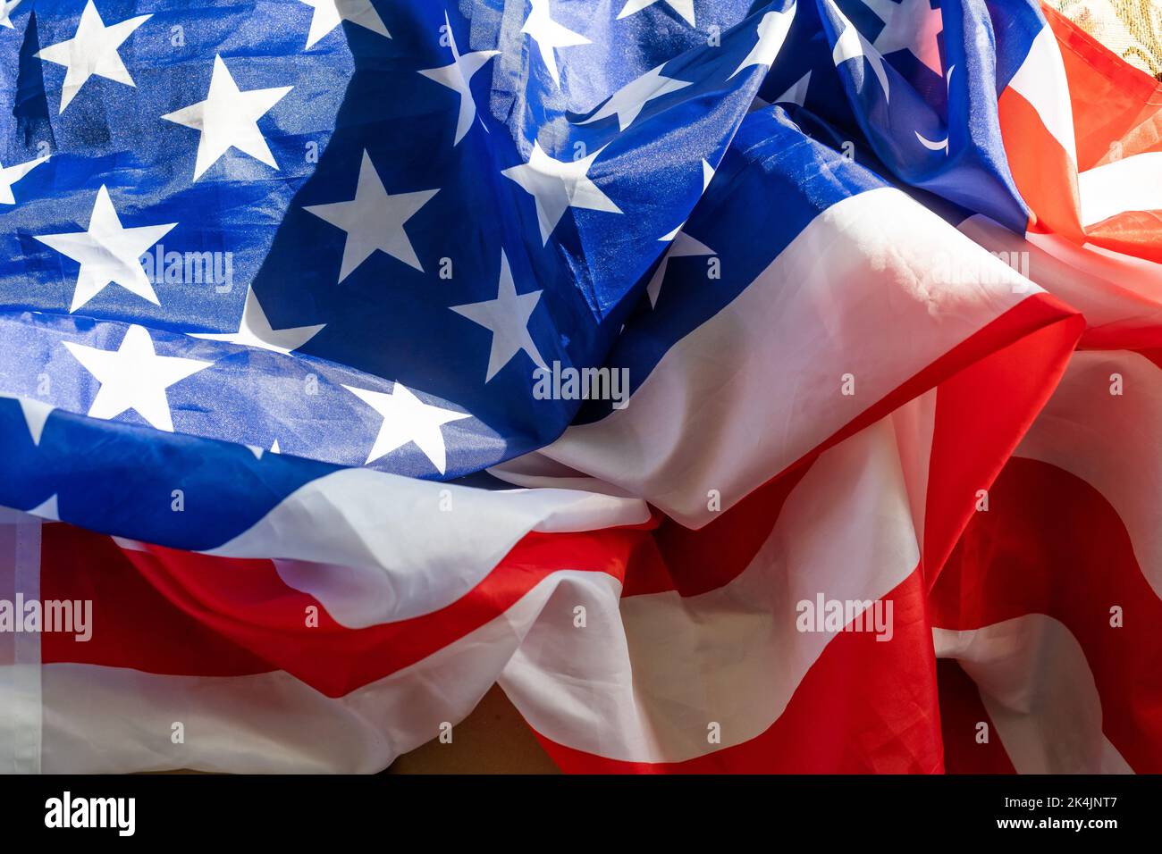 Stars and Stripes Flag background; rippling red white and blue silken ...
