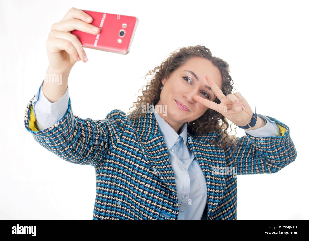 of a cute lovely woman taking selfie and showing peace sign with ...