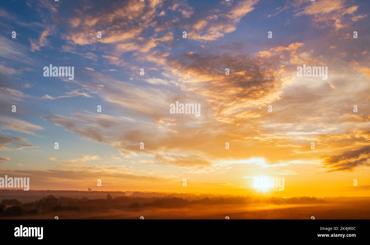 Bright colored sunrise or sunset in the countryside. A wonderful ...