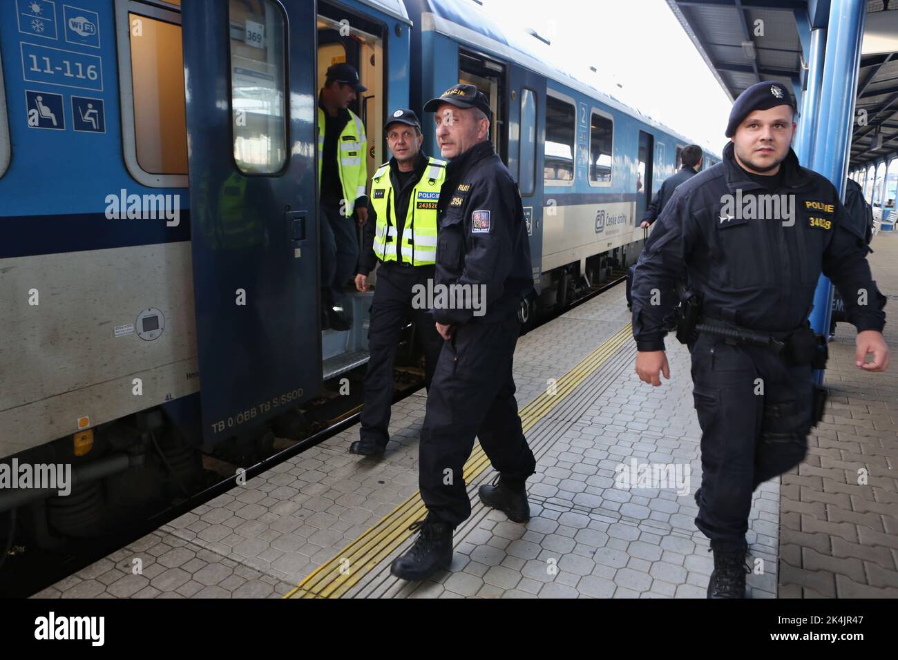 Police officers at the railway station in Breclav inspect a train ...
