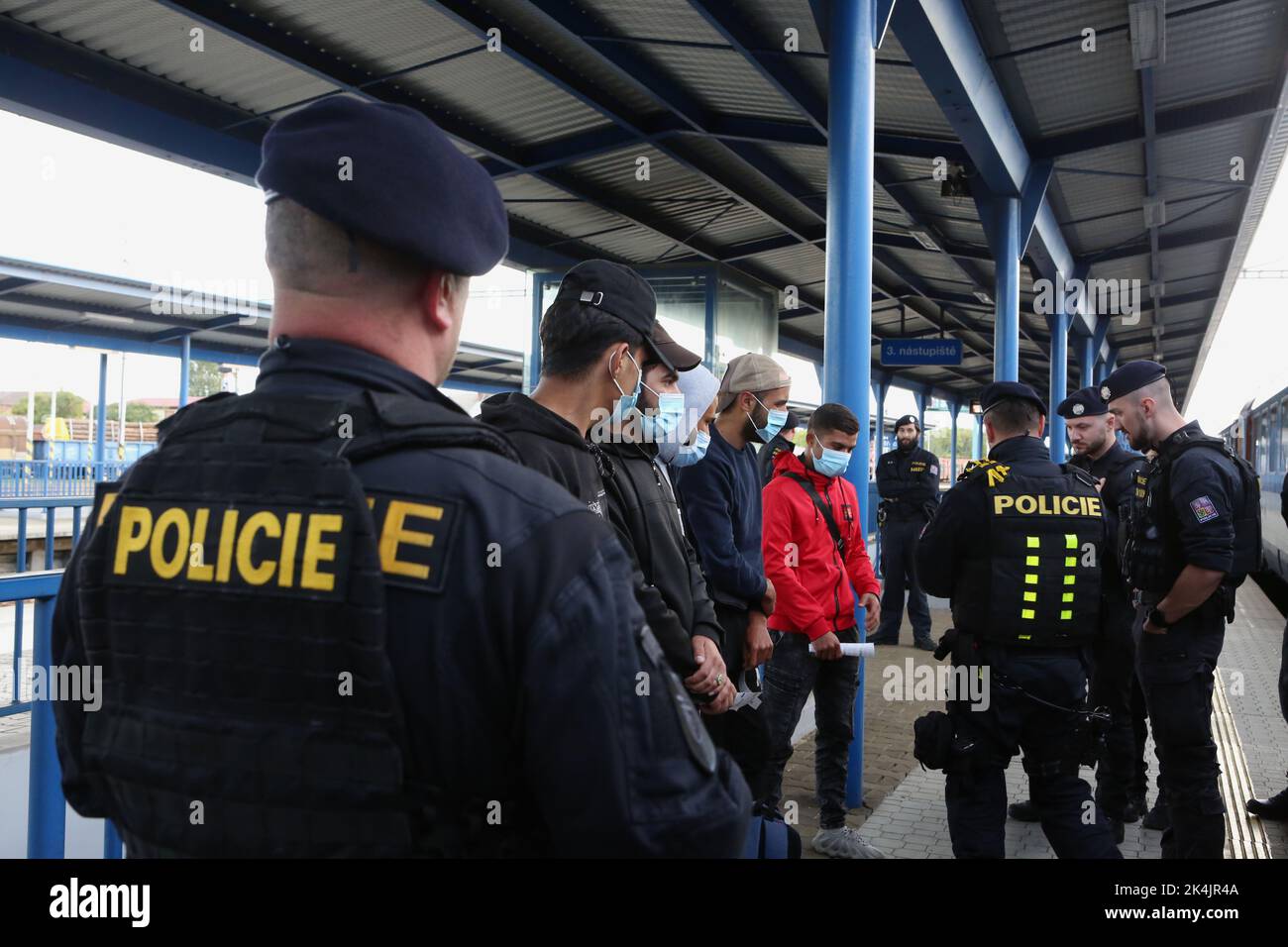 Police officers at the railway station in Breclav inspect a train ...