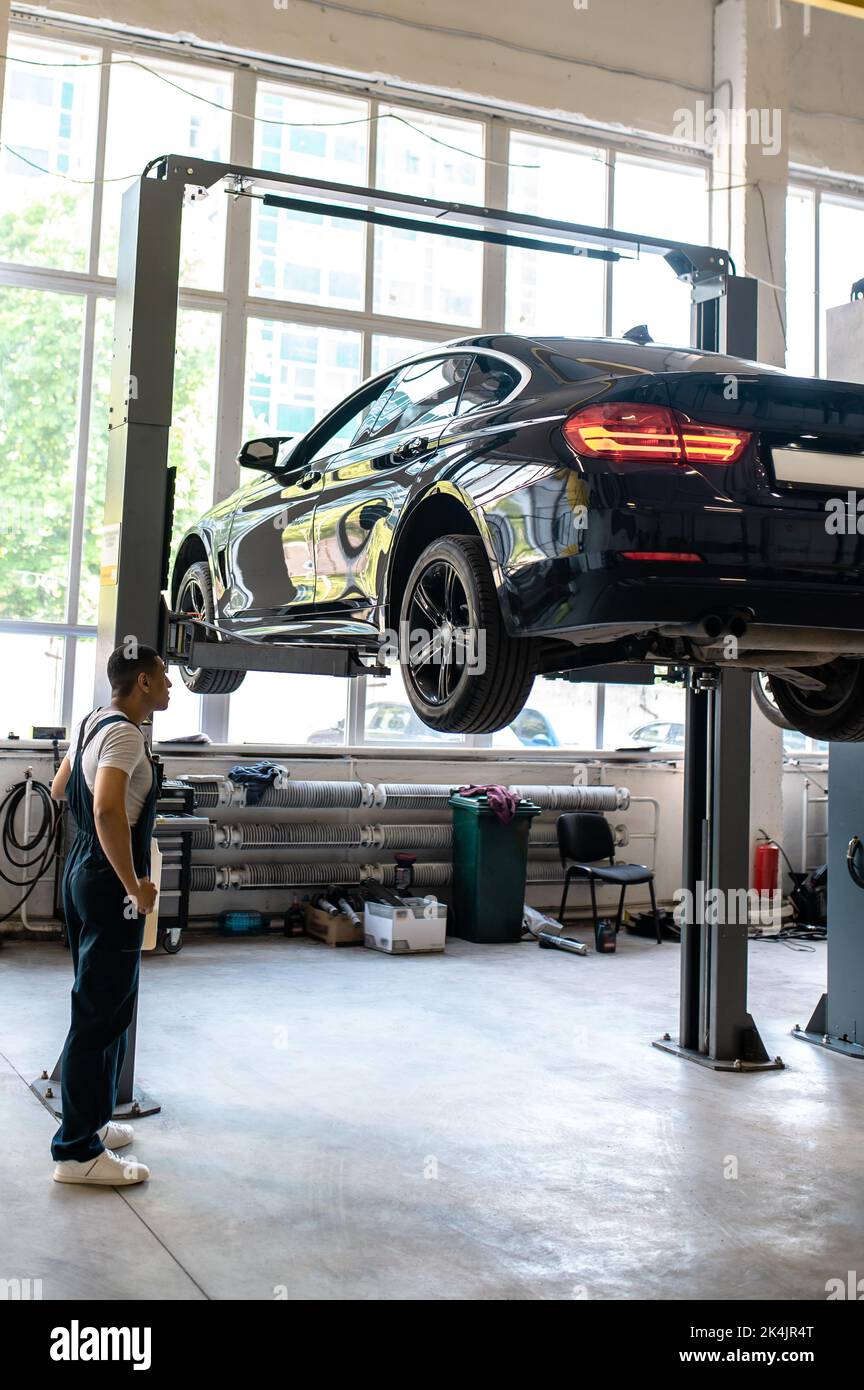 Car technician preparing the client auto for visual inspection Stock ...