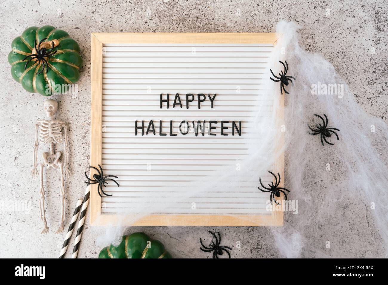 Happy halloween holiday concept. Skeletons, spider, web, pumpkin, text ...