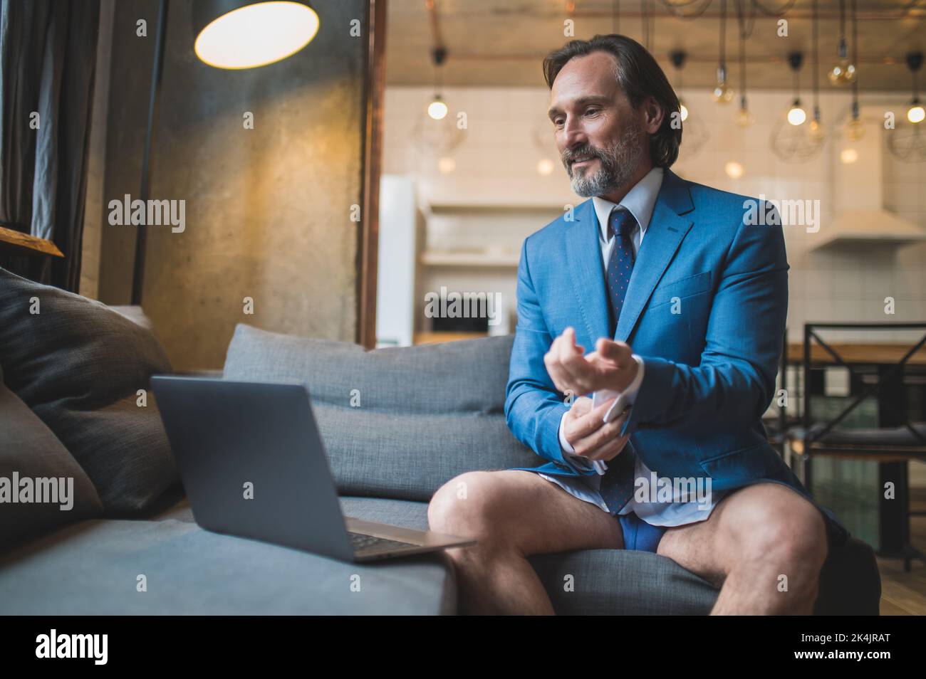 Man sitting in front of the laptop waiting for the video call Stock ...