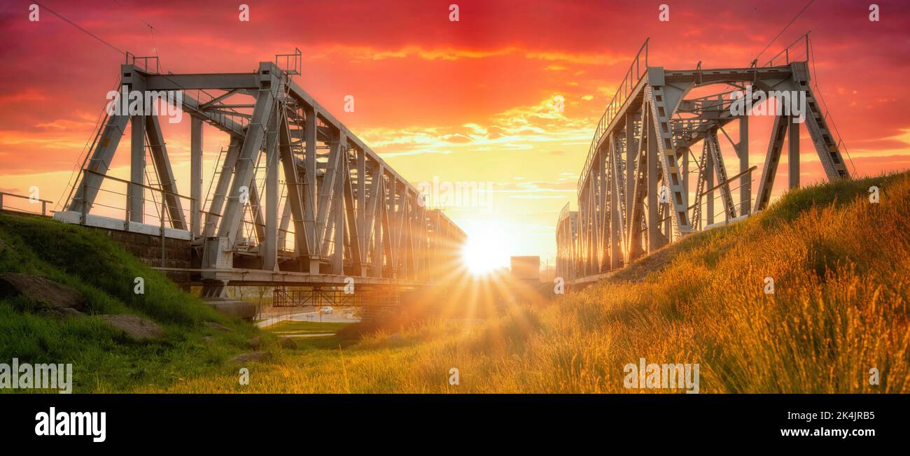 Railway metal bridge over the river. Sunset or dawn Stock Photo - Alamy