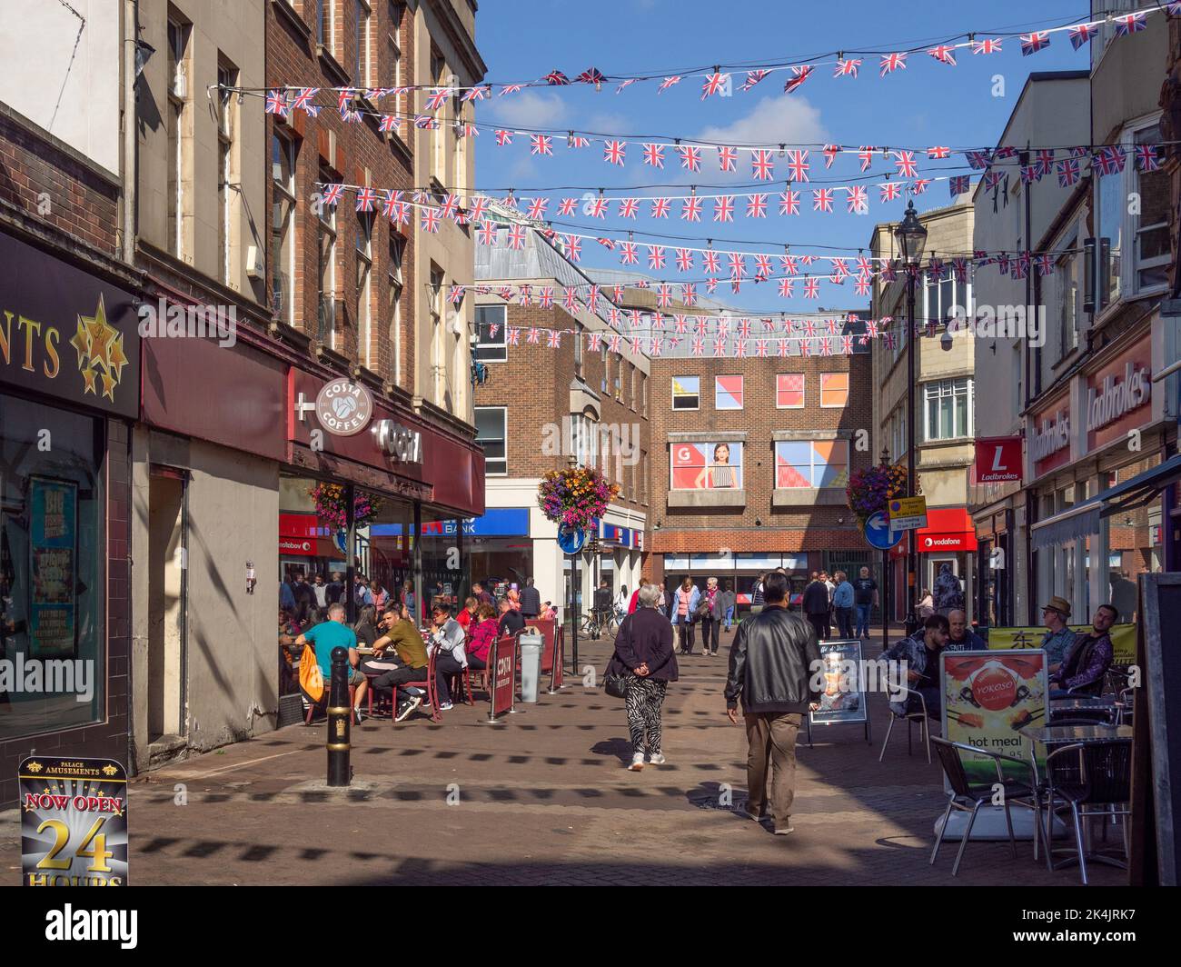 Pavement cafes and visitors on a summer day in a pedestrianised area of ...