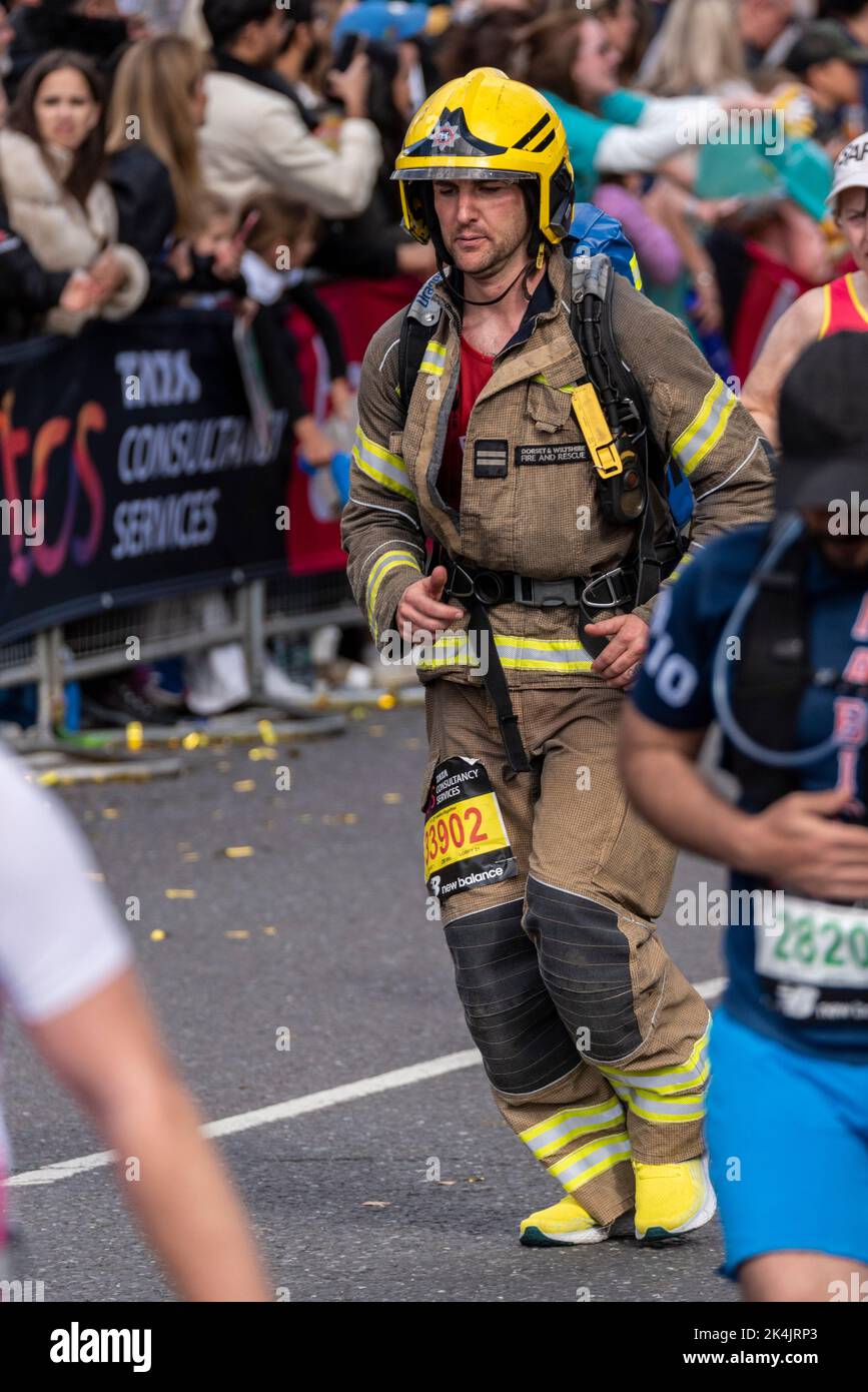 Dan Fry running in the TCS London Marathon 2022, on Tower Hill road ...