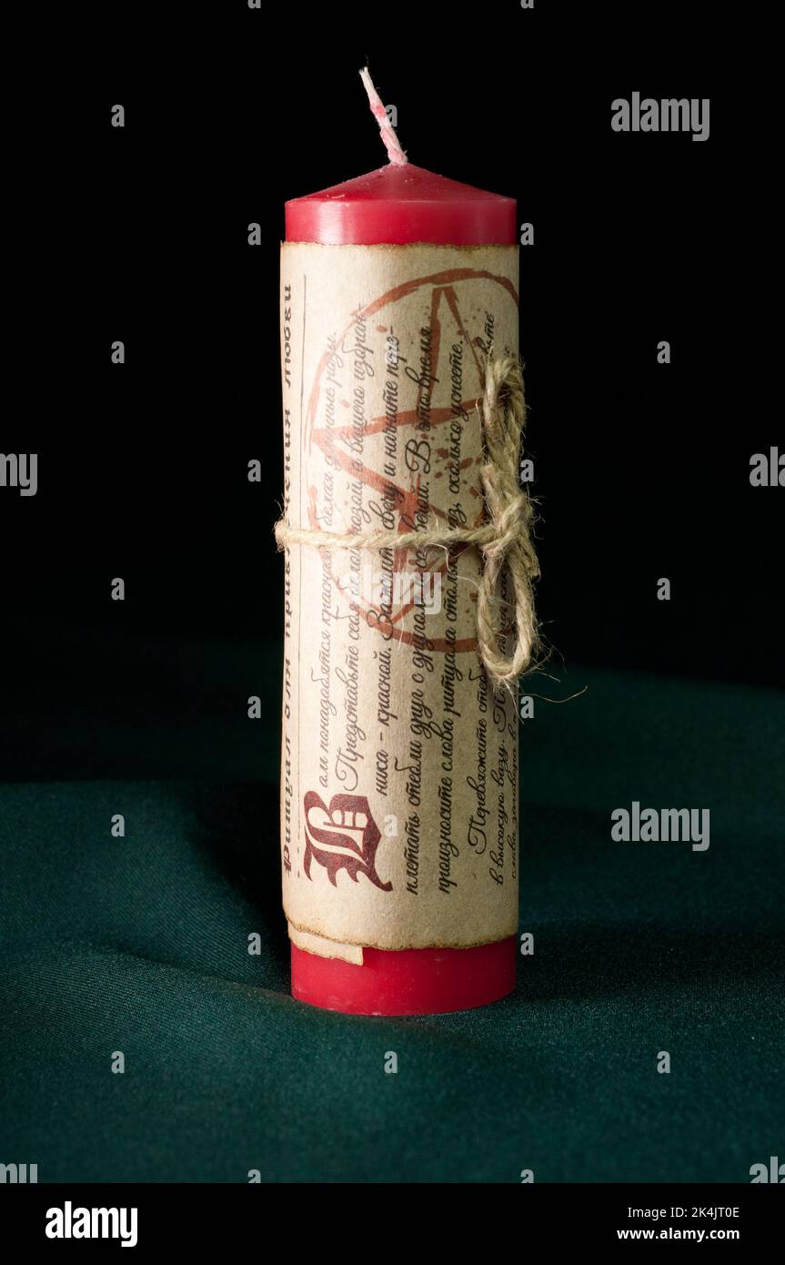 The magic candle on a colored background Stock Photo - Alamy