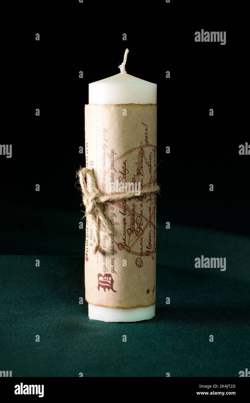 The magic candle on a colored background Stock Photo - Alamy