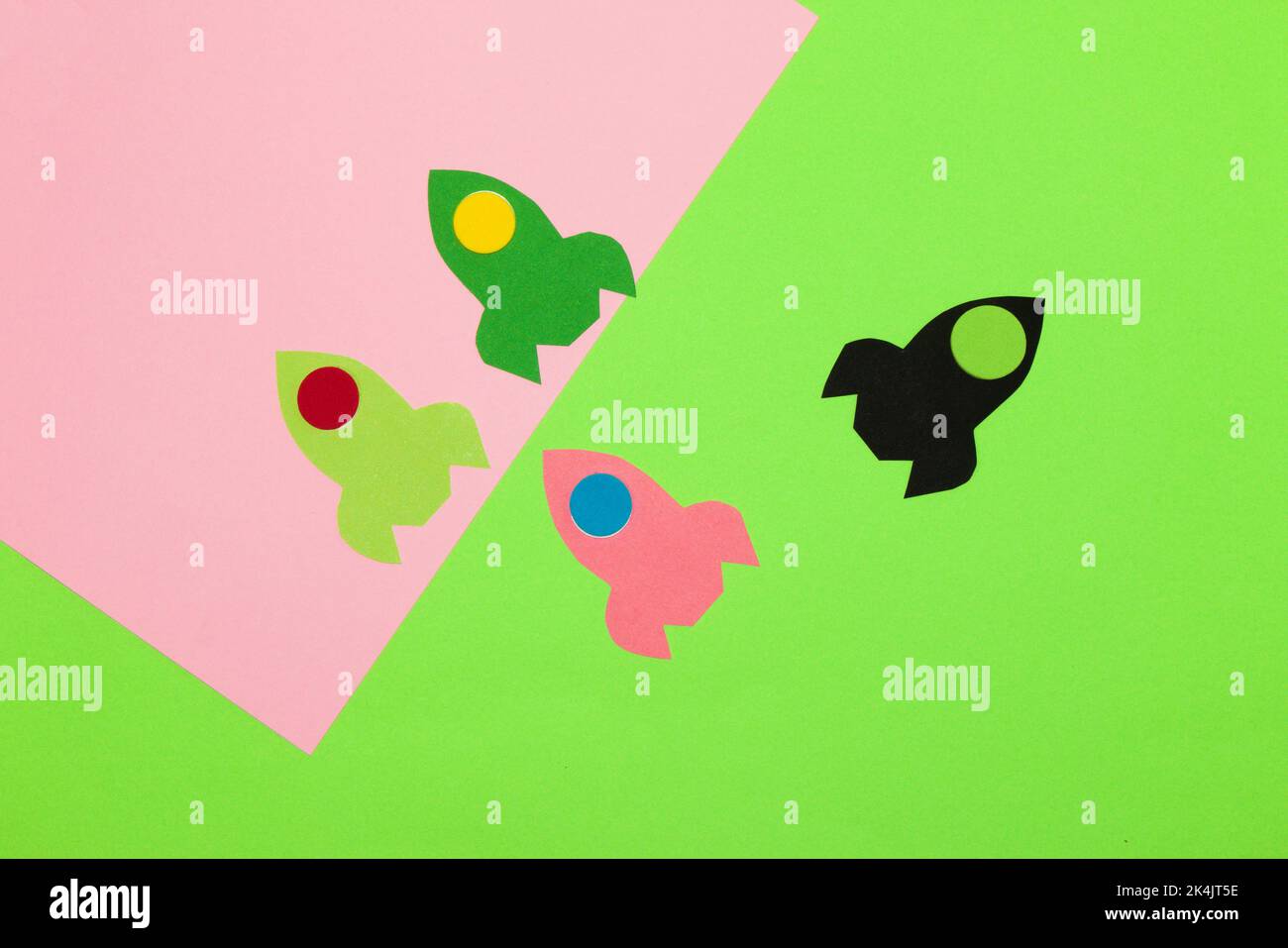 colorful rockets fly in one direction, one rocket stands out and flies ...