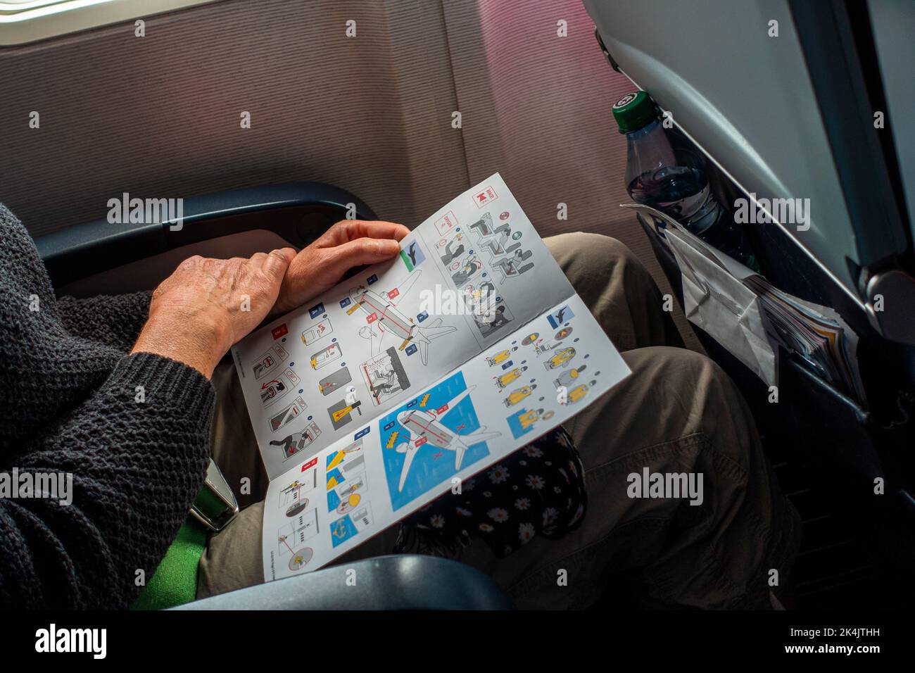 A passenger study safety precautions leaflet on Smartwings plane Boeing ...