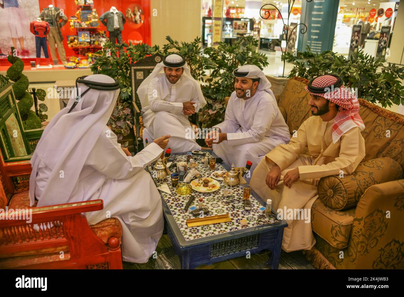 SHARJAH, UAE - DECEMBER 13, 2004: Four unidentified Arab gentlemen ...