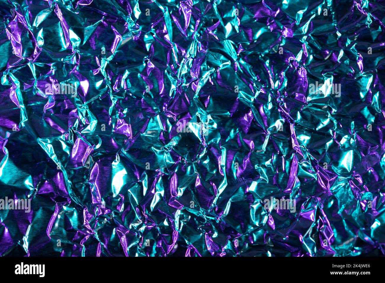 Abstract foil background with color light Stock Photo - Alamy