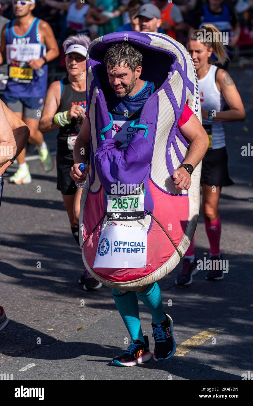 Paul Addicott running in shoe costume the TCS London Marathon 2022, on ...