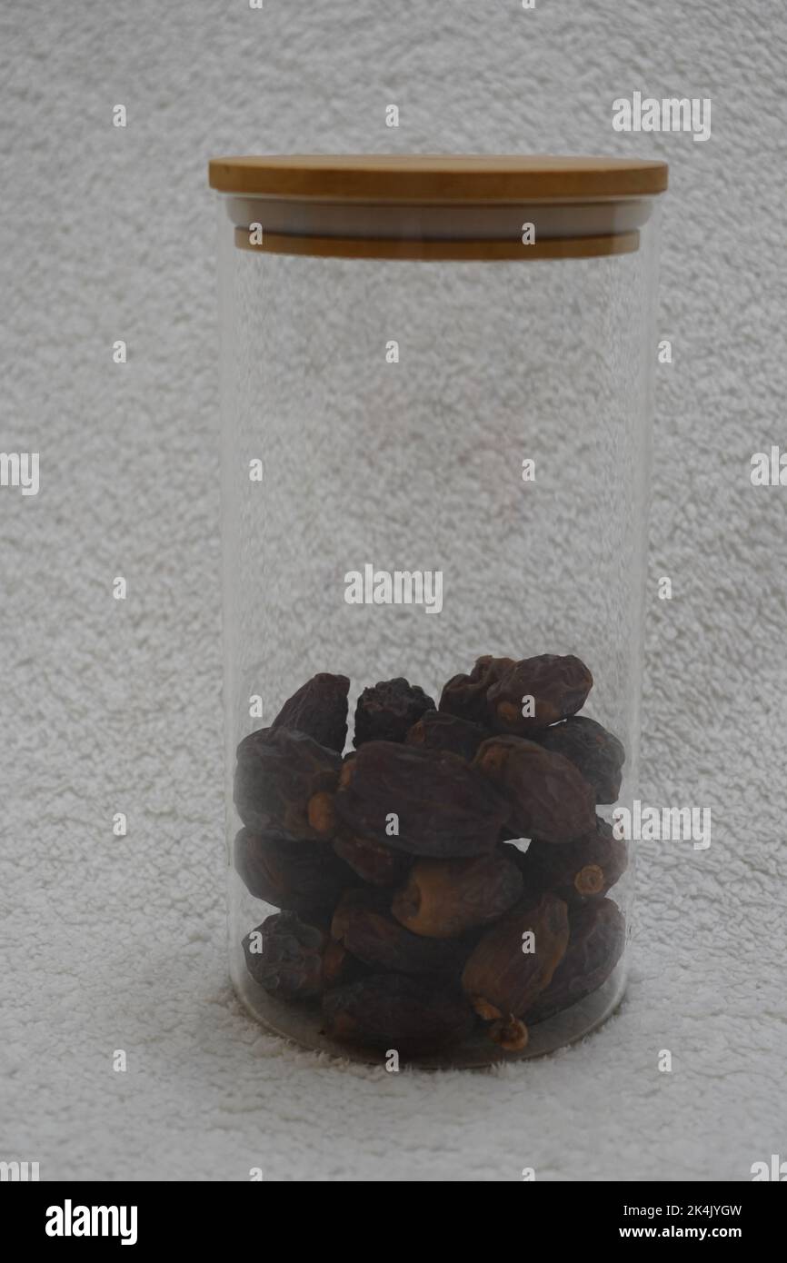 dates in glass jars, wooden lids on rustic white kitchen wooden white ...