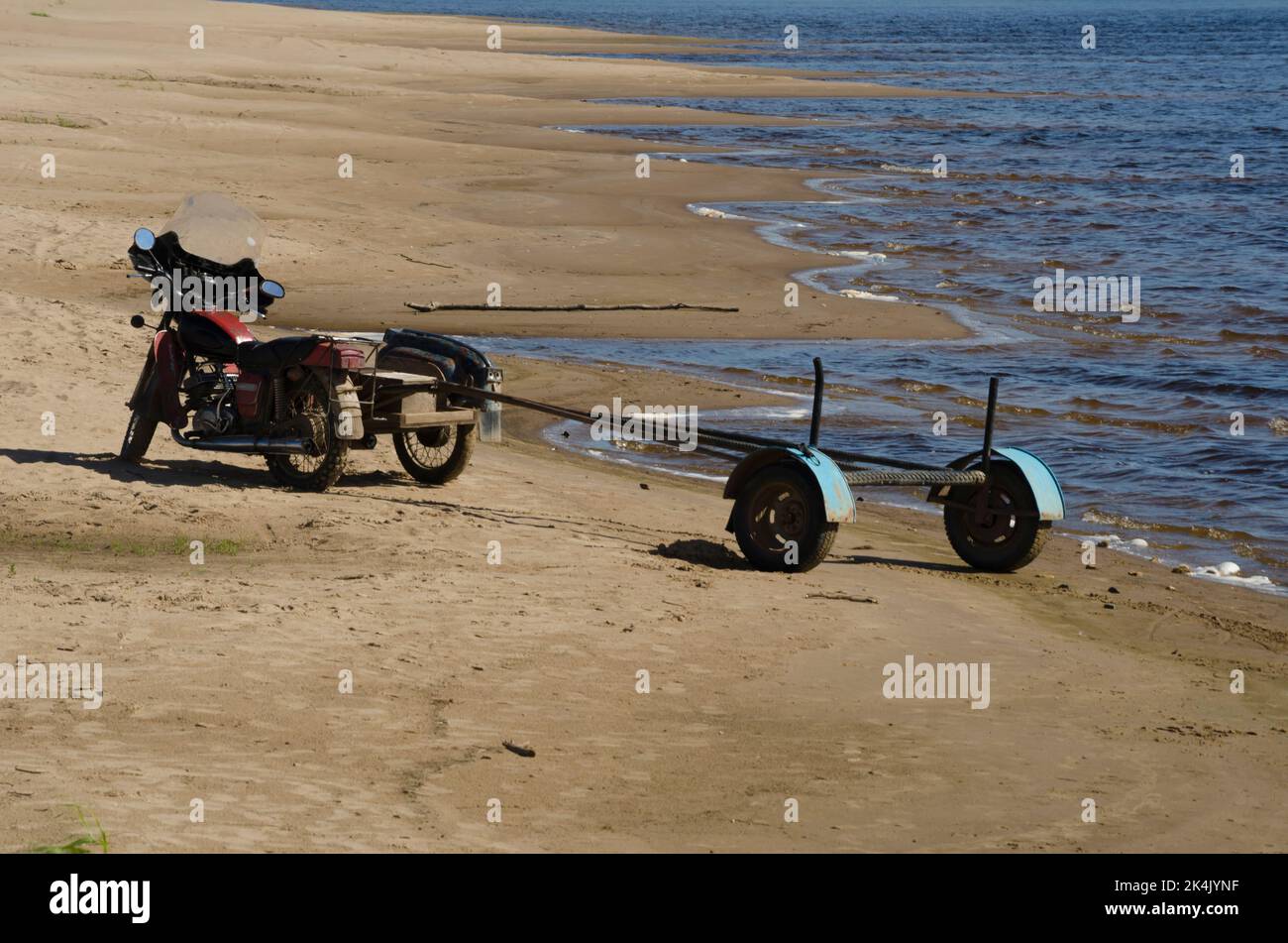 Motorcycle with boat trailer. Country life Stock Photo - Alamy