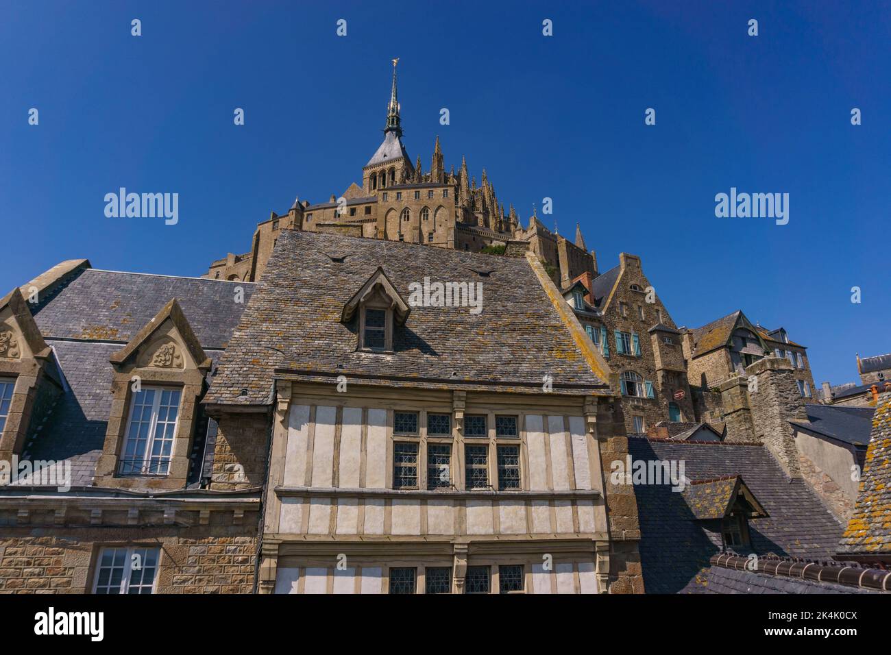 Ancient half timbered buildings of the old town with view at the abbey ...