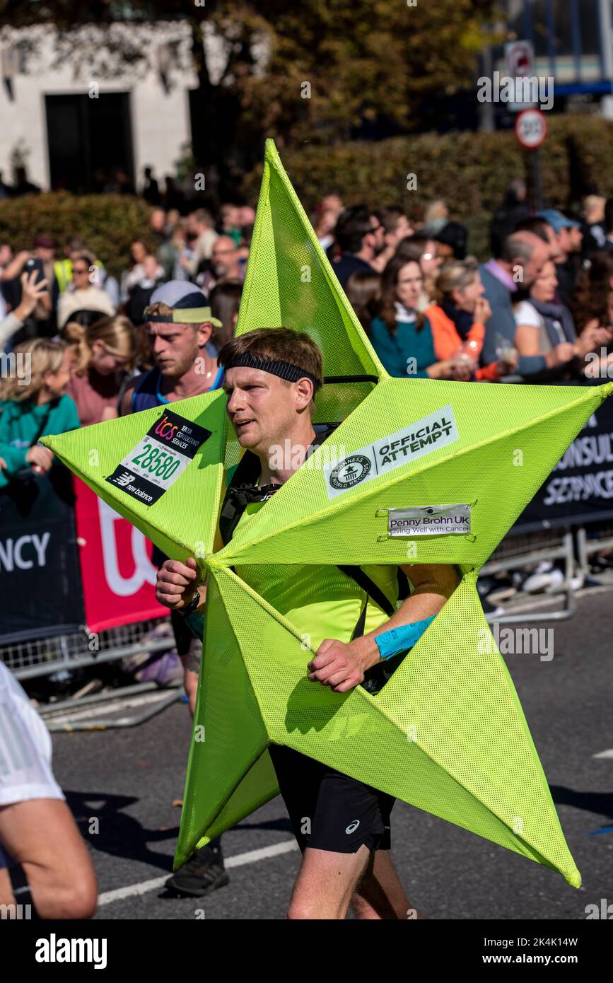 Matt Brooks running in the TCS London Marathon 2022, on Tower Hill road ...