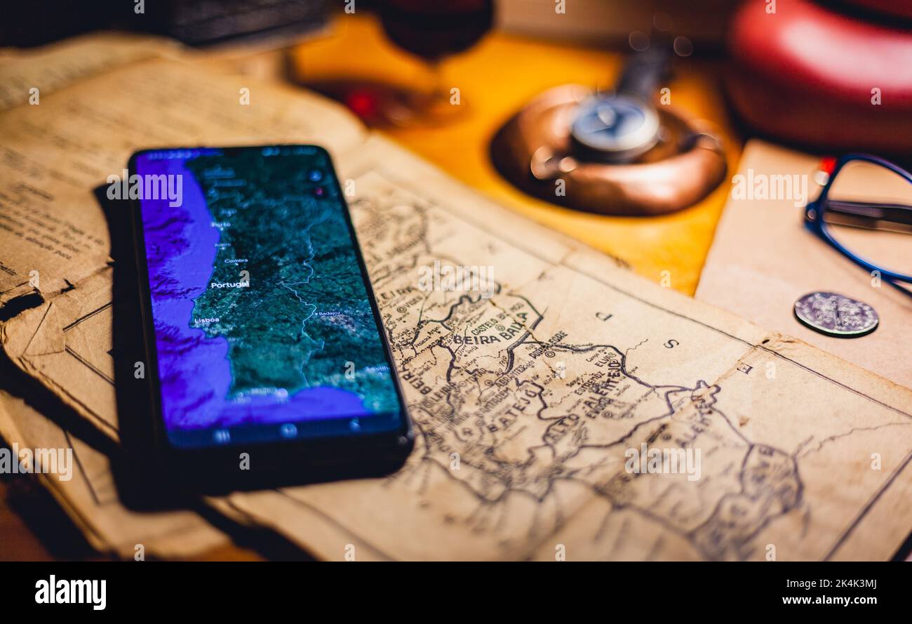 old map and mobile phone with a map on the display Stock Photo - Alamy