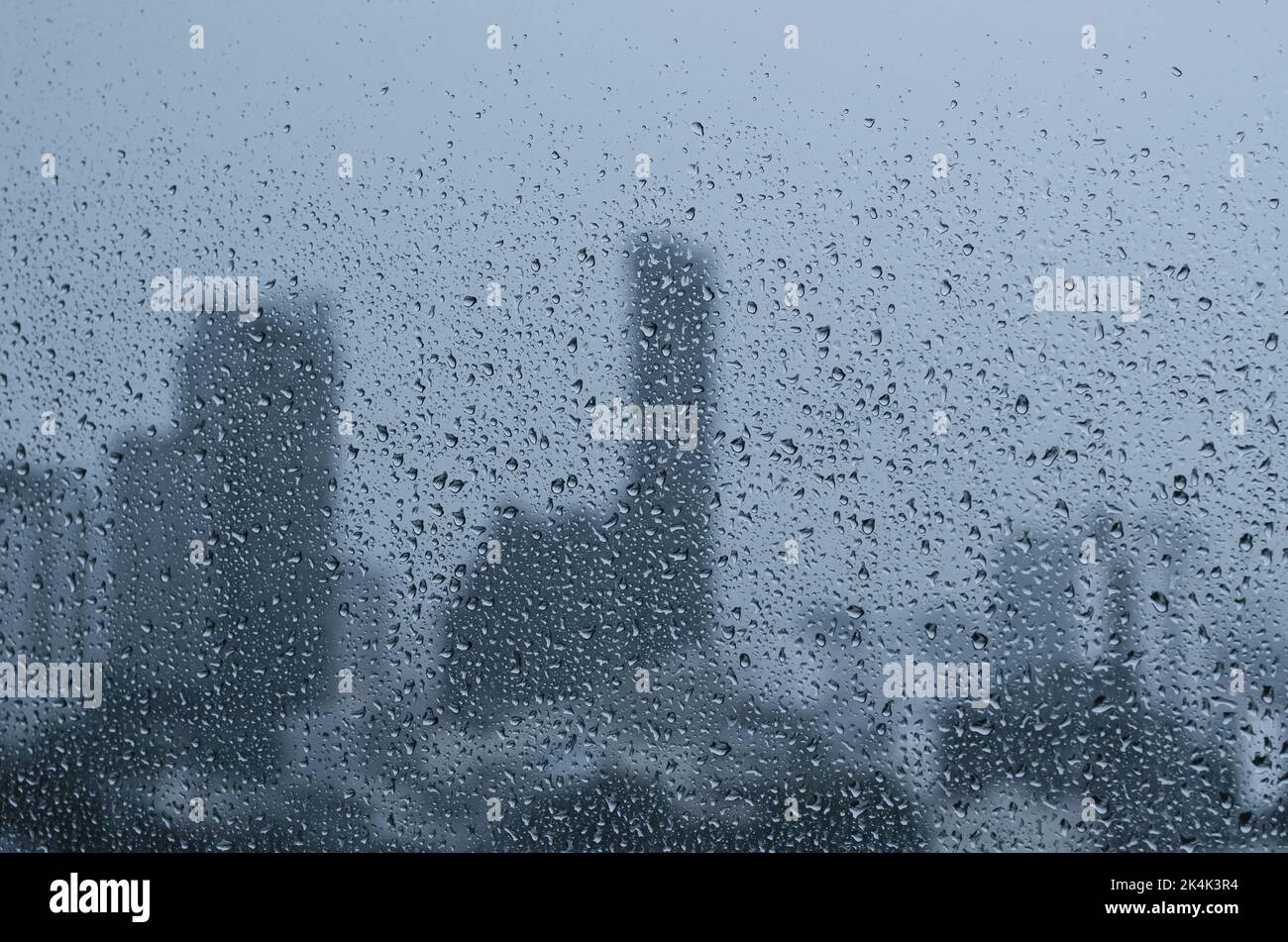 Rain drop on glass window at day time in monsoon season with blurred ...