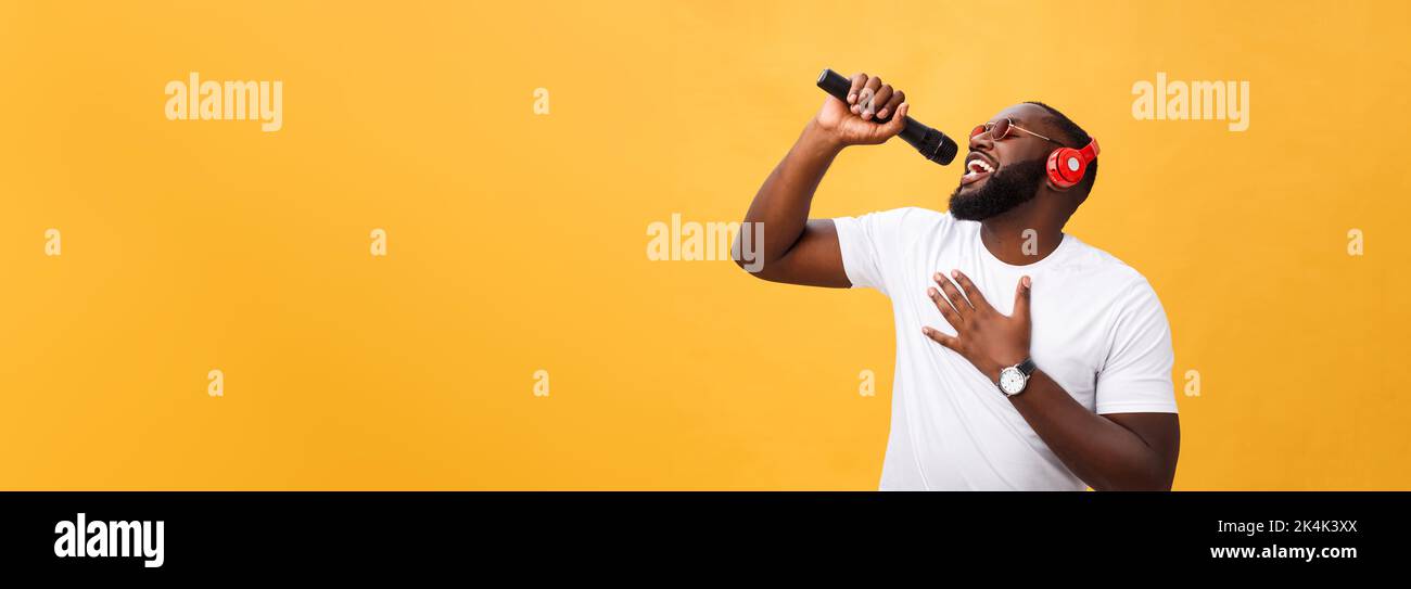 young handsome african american boy singing emotional with micro Stock ...