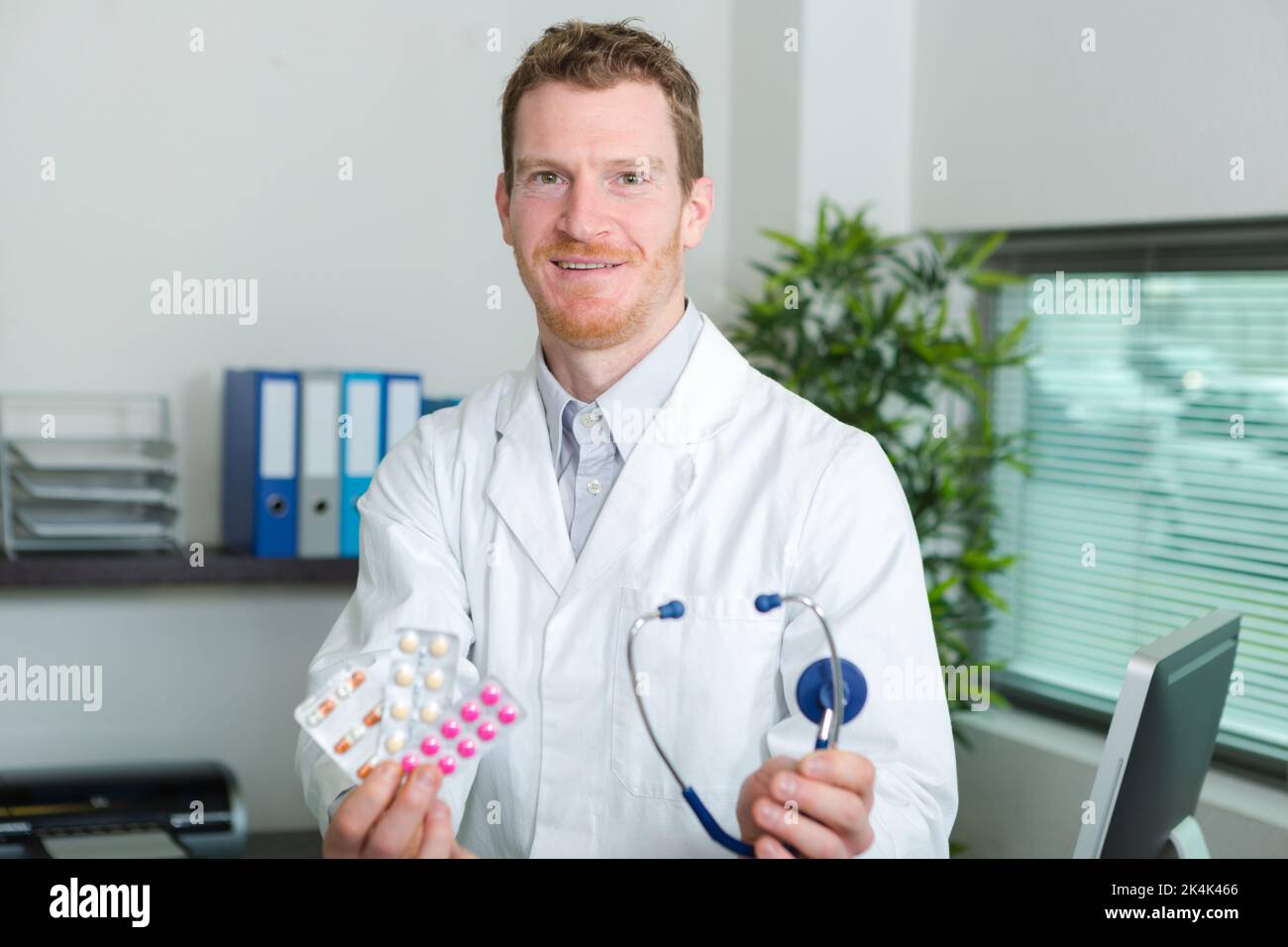 mad doctor showing pills Stock Photo - Alamy