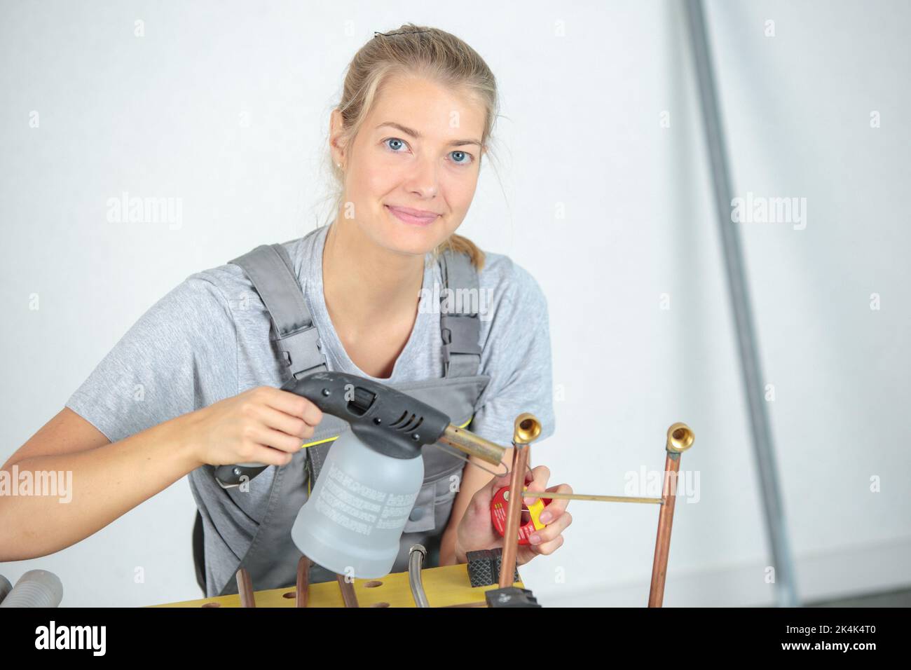 worker using blowtorch for soldering copper fittings Stock Photo - Alamy