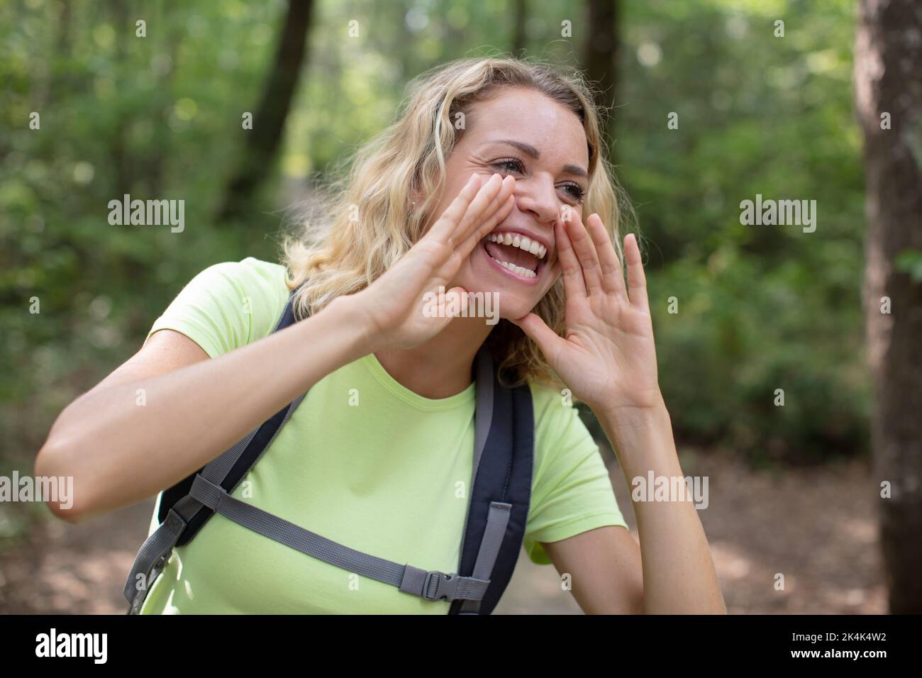 attractive girl screaming in the forest Stock Photo - Alamy