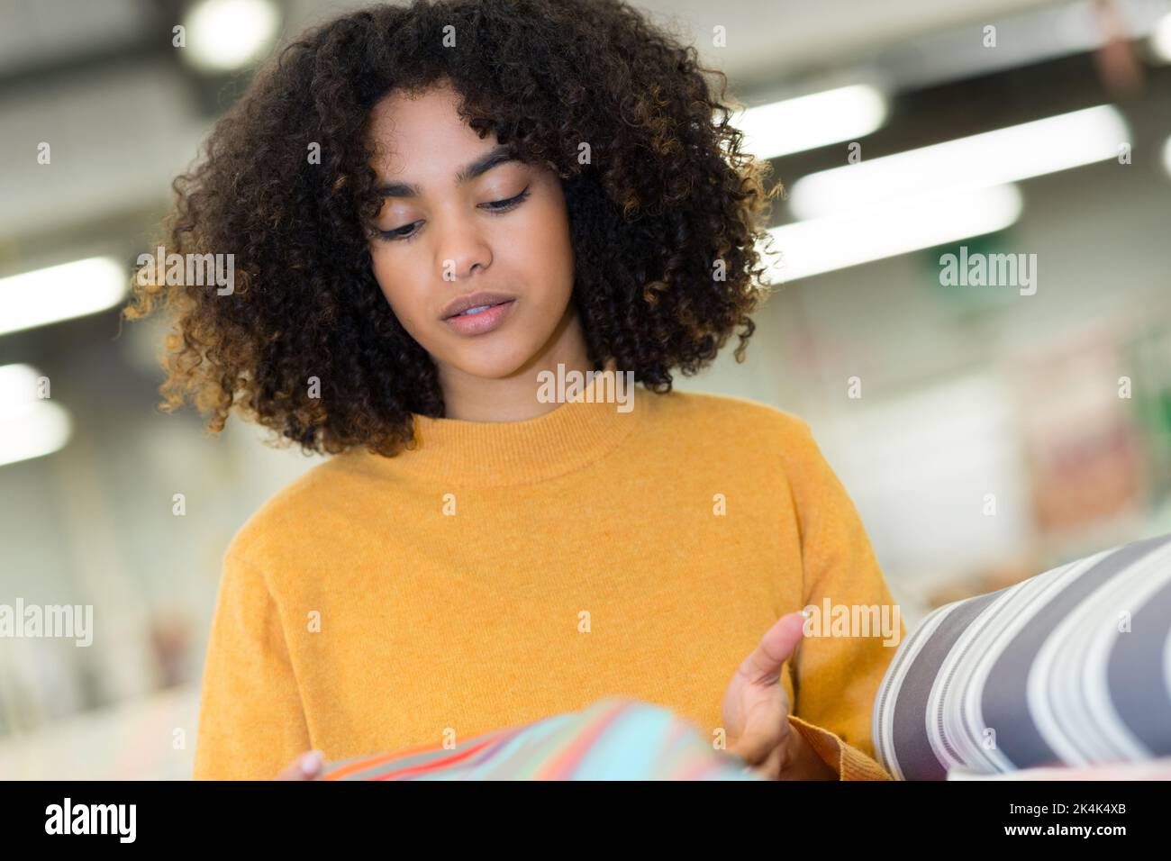 portrait of a female haberdasher at work Stock Photo - Alamy