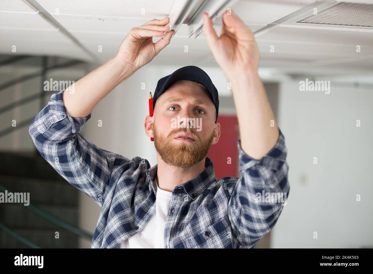 Fixing new wiring ceiling hi-res stock photography and images - Alamy