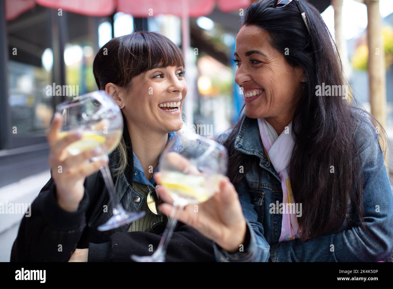 Two friends drinking coffee cafeteria hi-res stock photography and ...