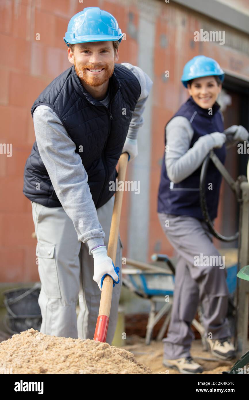 construction builders busy making the cement Stock Photo - Alamy