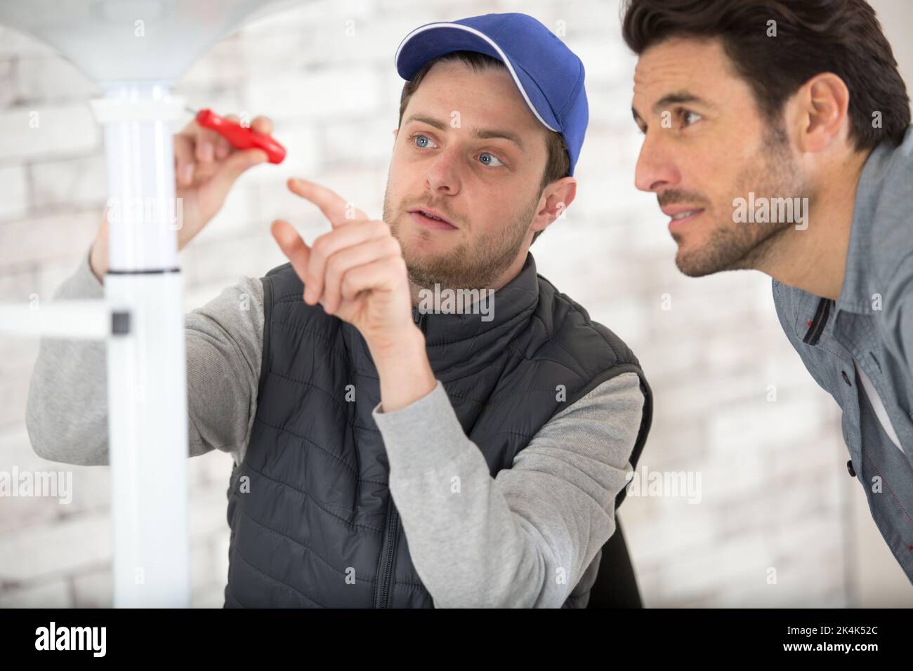 worker with apprentice Stock Photo - Alamy