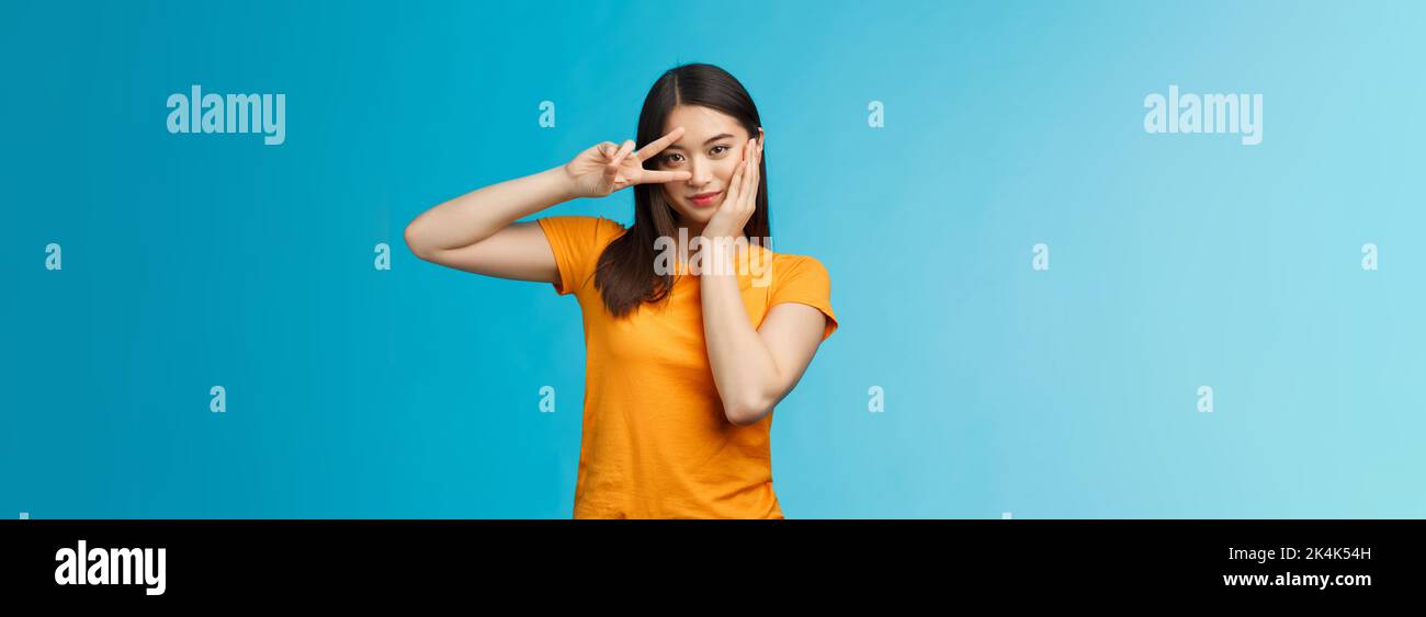 Sassy stylish good-looking asian assertive korean girl show peace ...