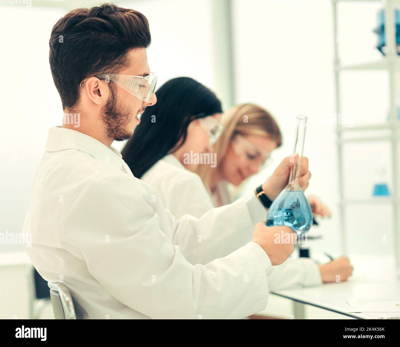 Medical research scientists examines hi-res stock photography and ...