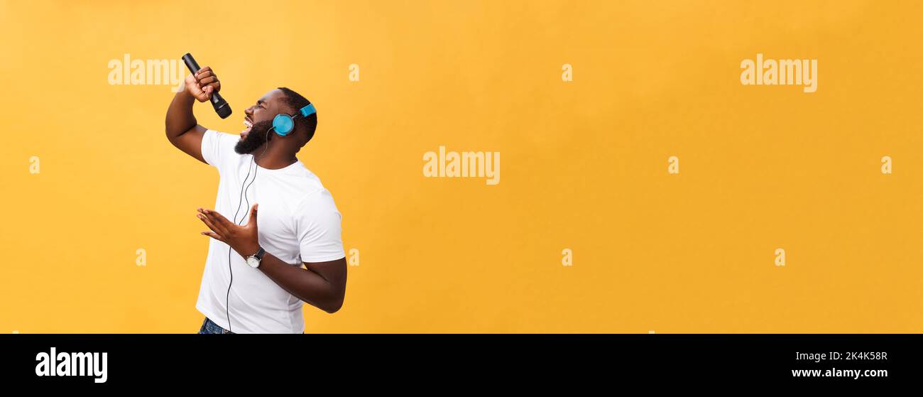 Portrait of cheerful positive chic handsome african man holding ...