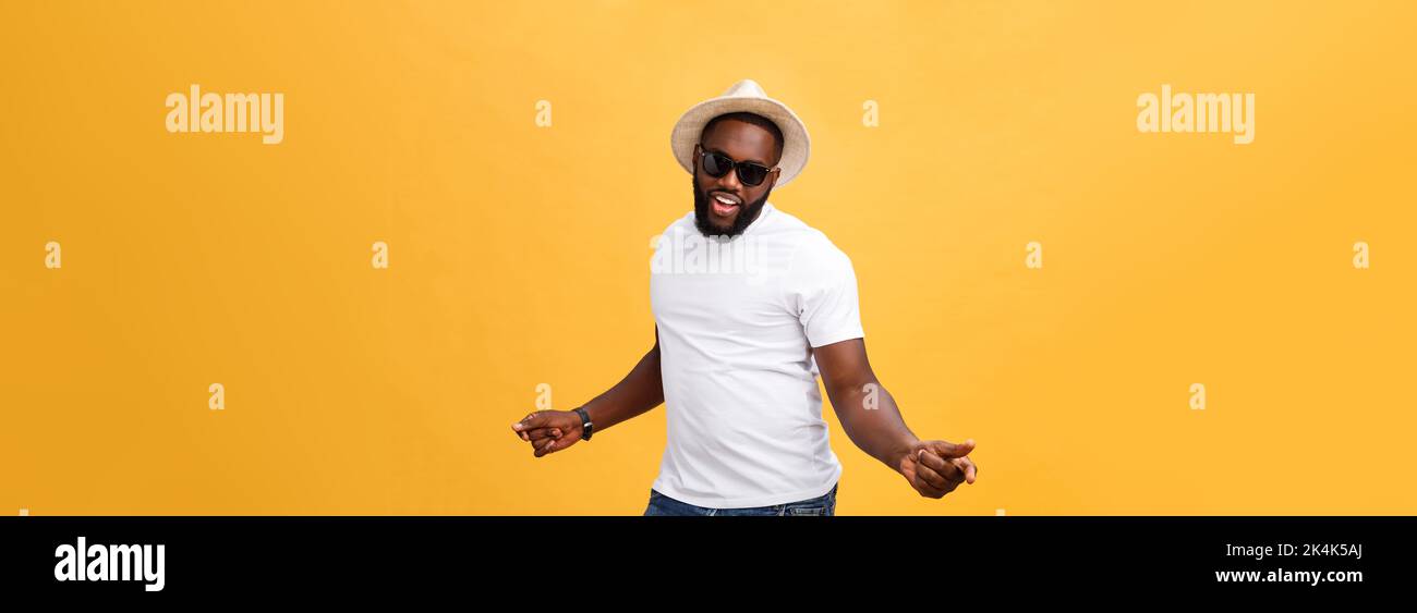 Young black man top dancing isolated on a yellow background Stock Photo ...