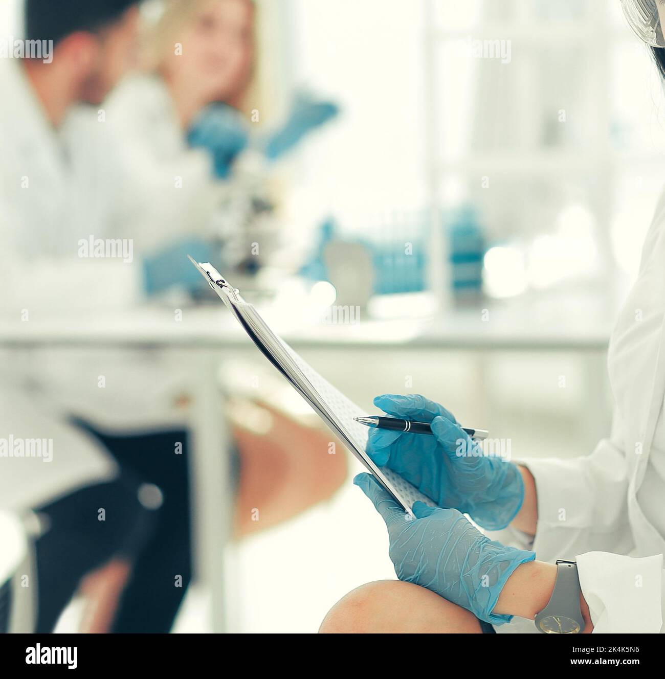 Woman reading science journal hi-res stock photography and images - Alamy