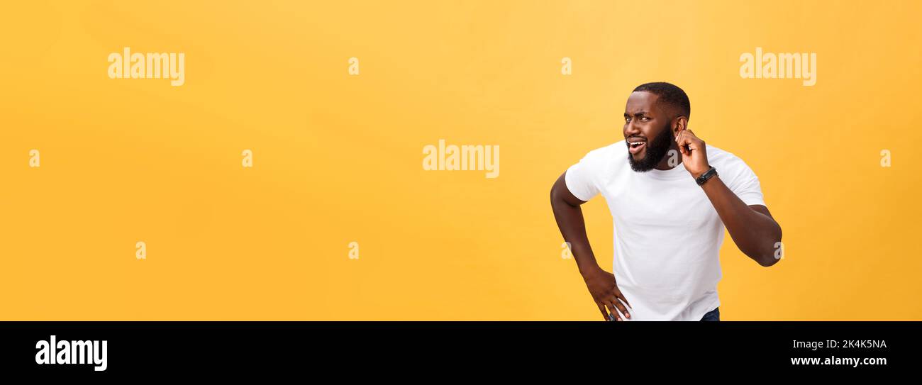 Headshot of goofy surprised bug-eyed young dark-skinned man student ...