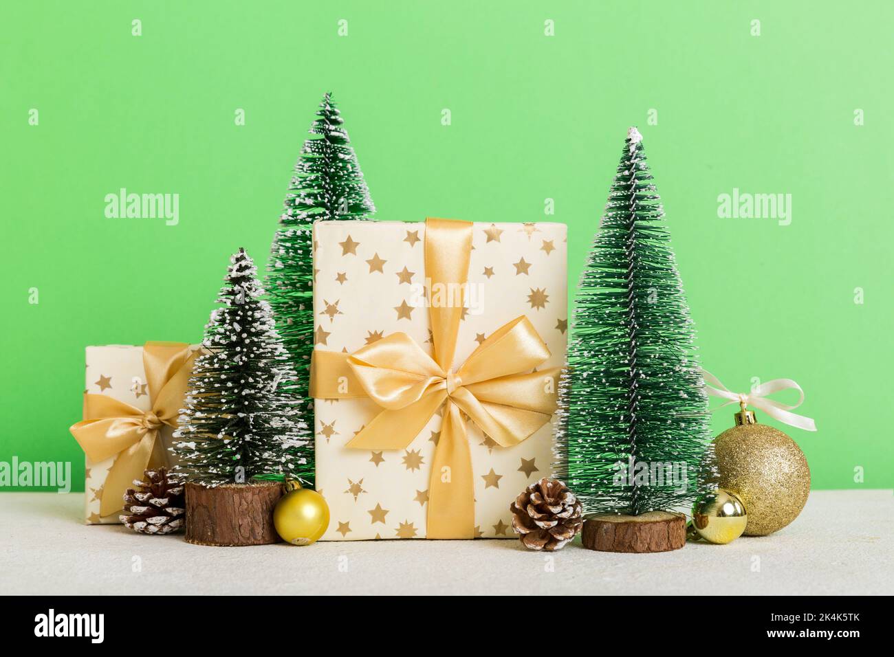 Christmas composition. craft Gift box, small tree, branches and craft ...