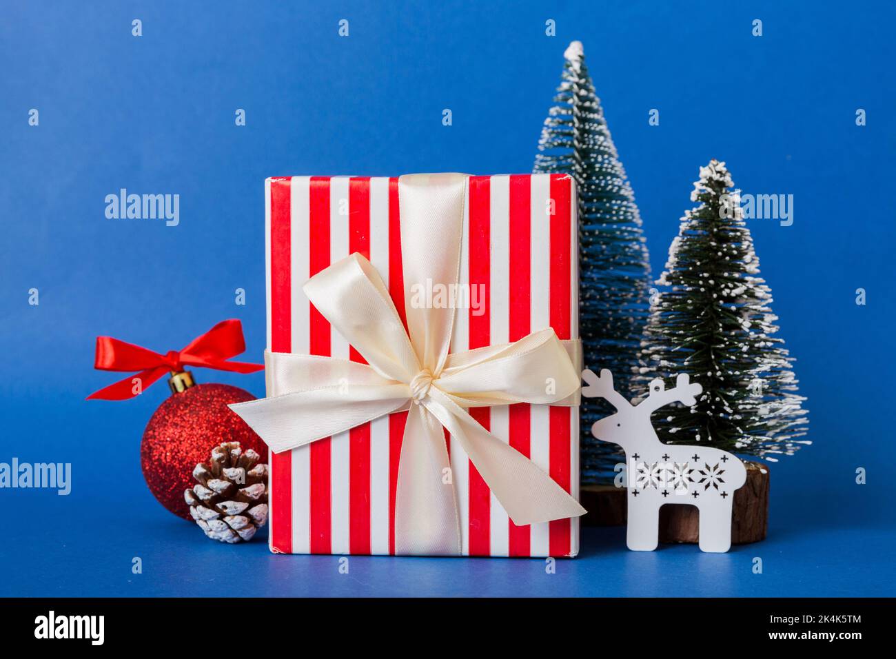 Christmas composition. craft Gift box, small tree, branches and craft ...