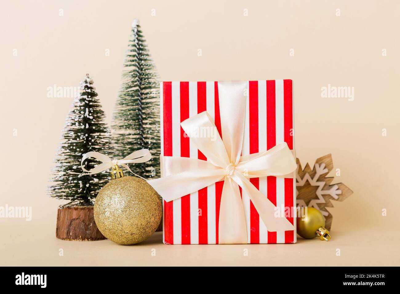 Christmas composition. craft Gift box, small tree, branches and craft ...