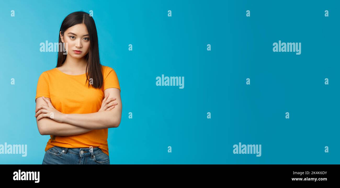 Serious-looking confident and arrogant asian woman cross hands chest ...