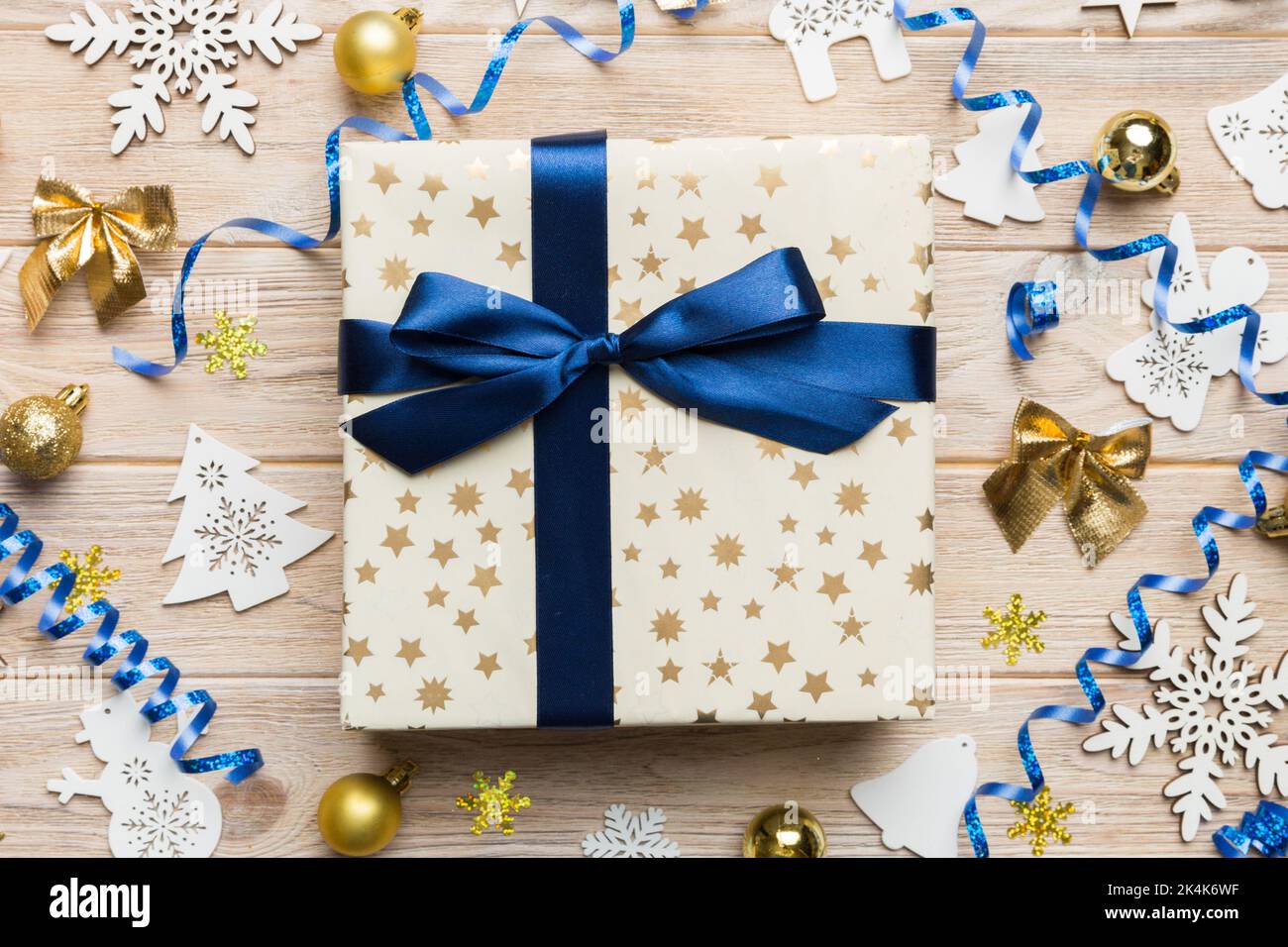 Christmas composition. Gifts box with new year decorations on colored ...