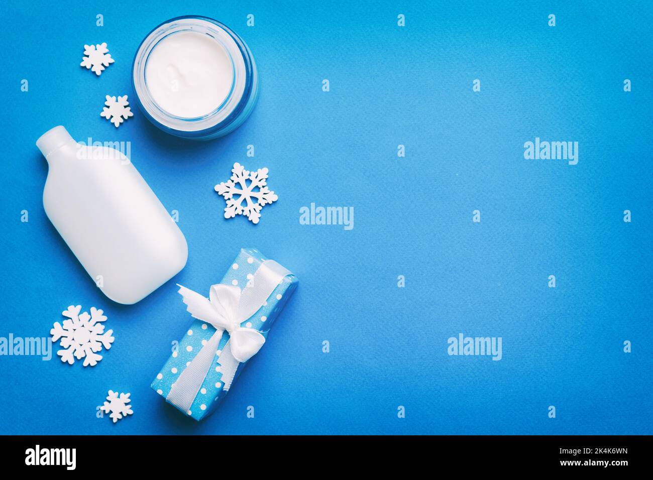 Makeup products and Christmas decorations on color background. Top view ...