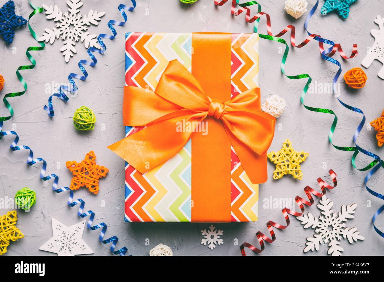 Christmas composition. Gifts box with new year decorations on colored ...