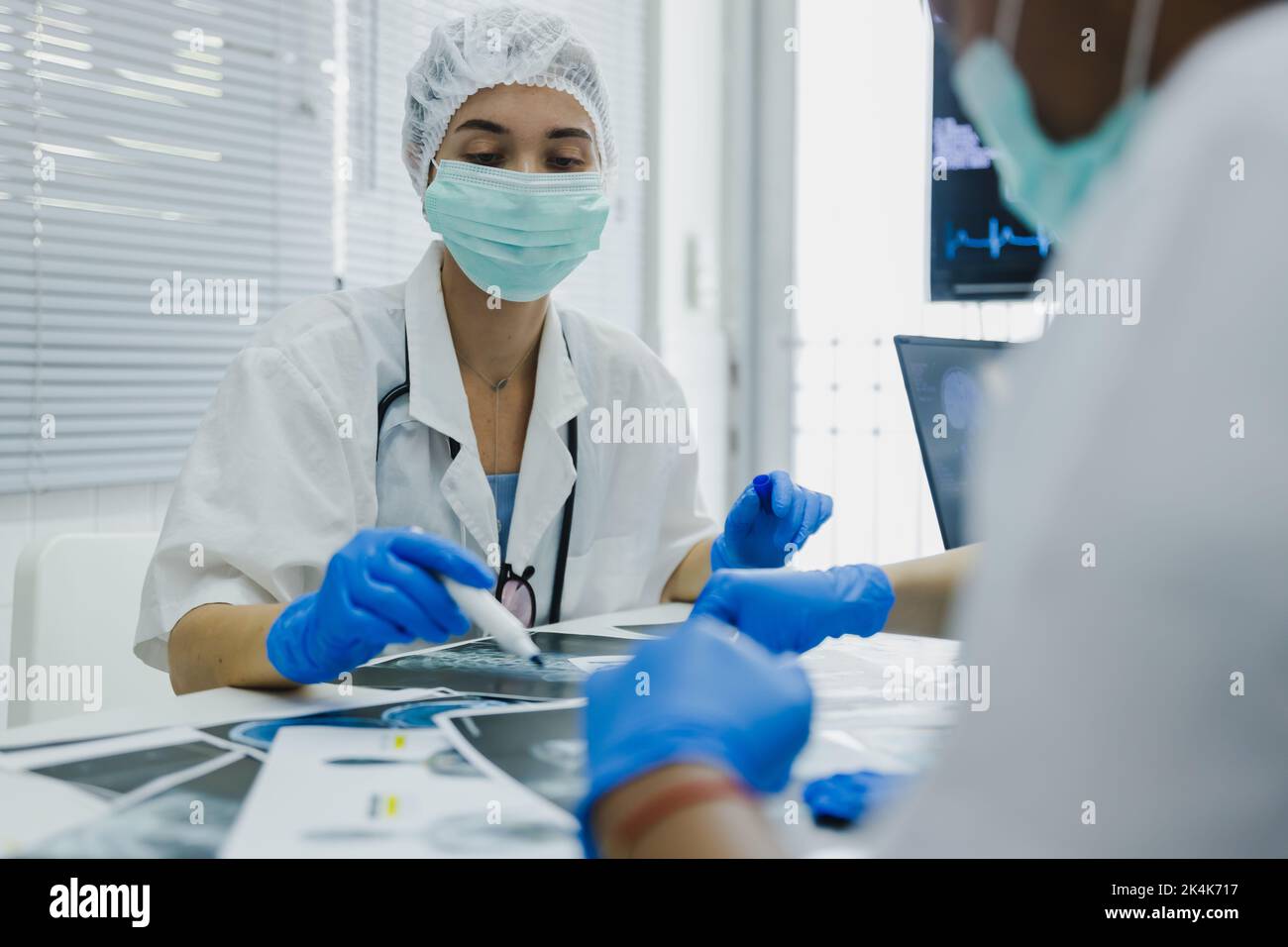 Team of female doctor check on scan results paper and looking at ...