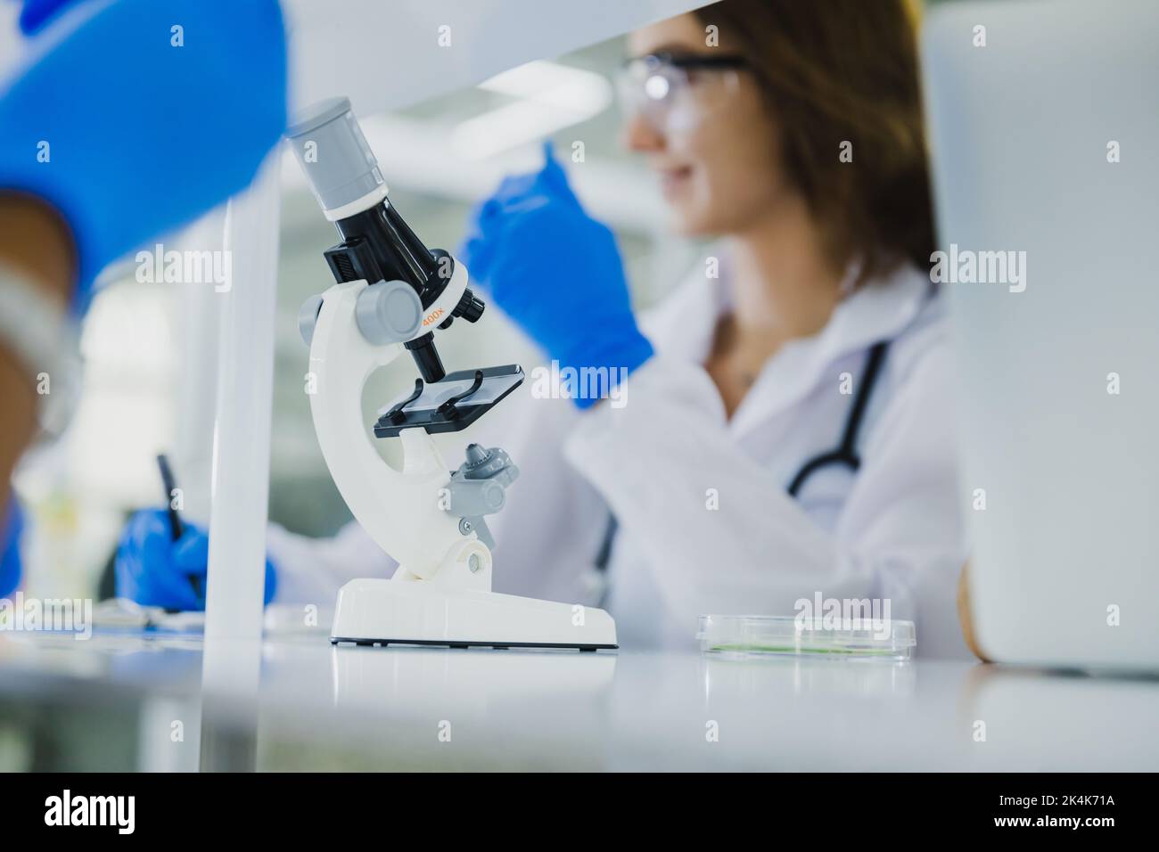 Young scientist using a microscope hi-res stock photography and images ...