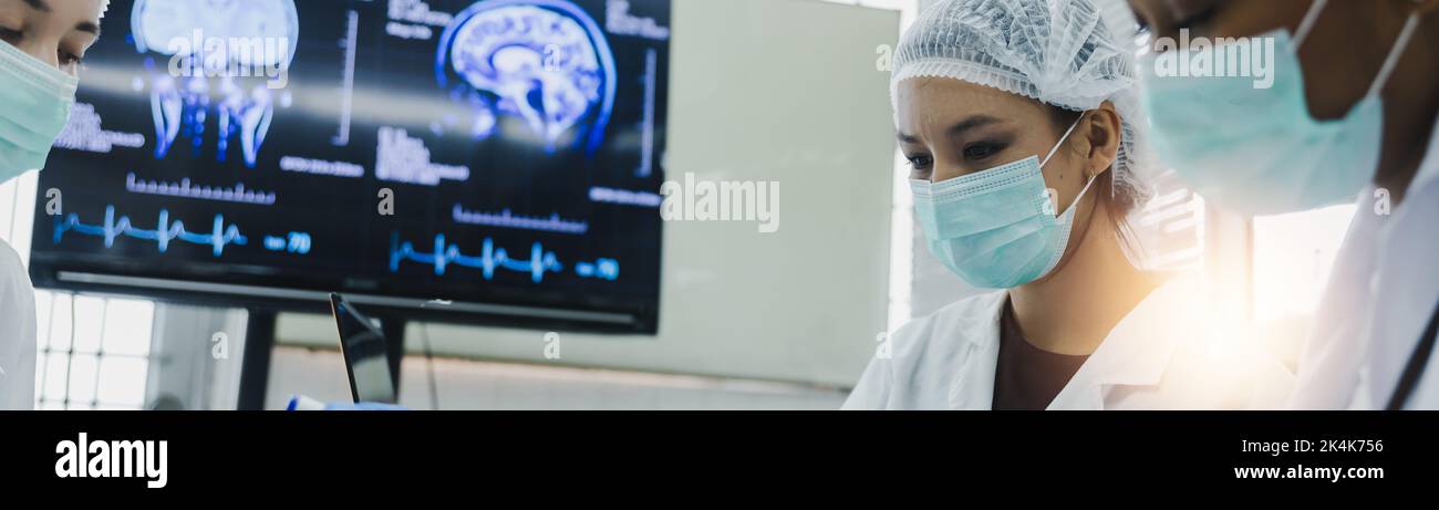 Team of female doctor check on scan results paper and looking at ...