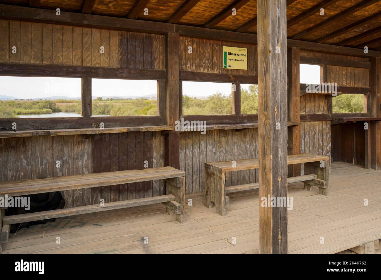 Interior of wooden bird hide or blind for birdwatchers or birdwatching ...